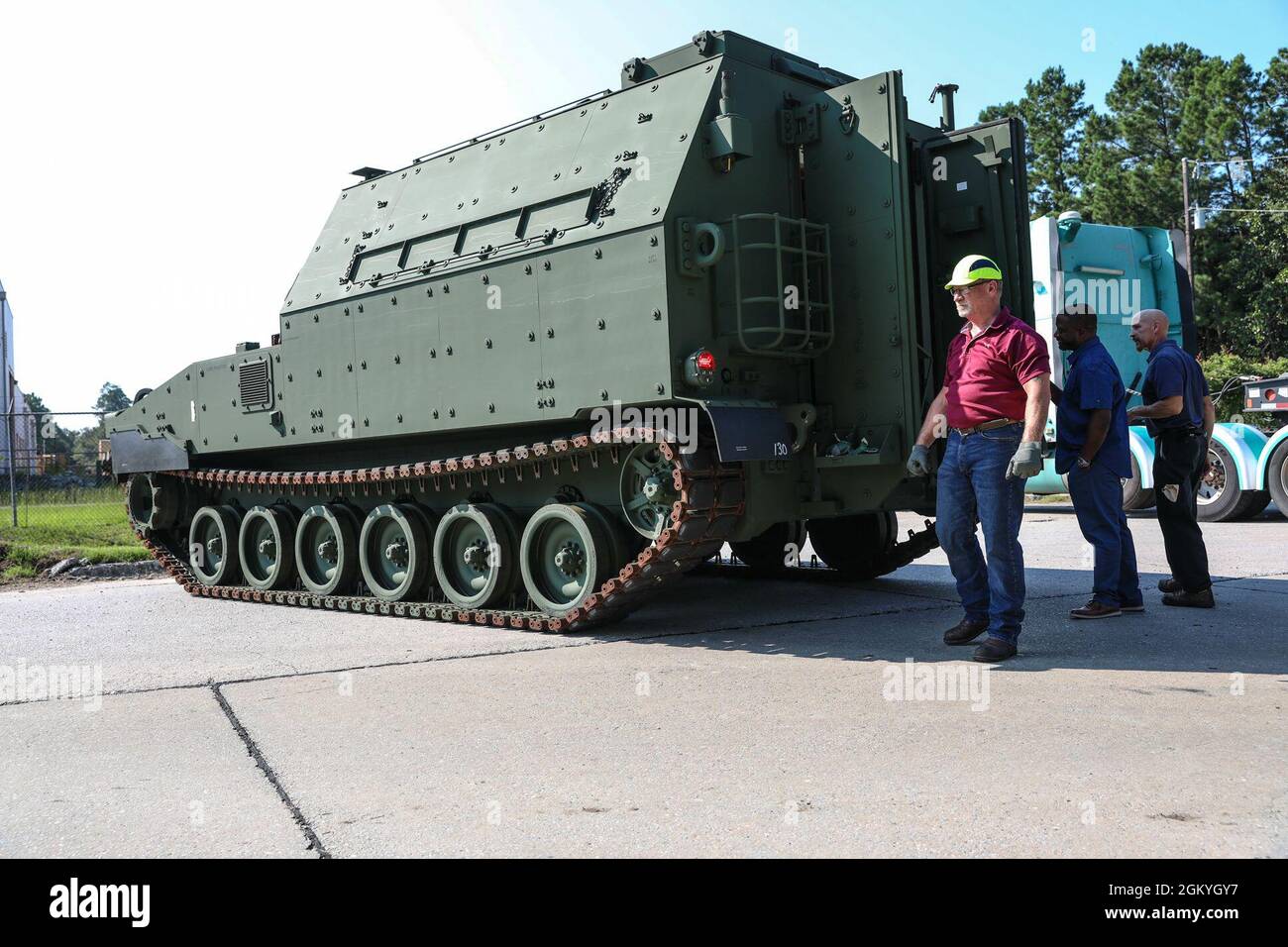 Department of Defense civilians inspect an M992A3 Carrier Ammunition ...
