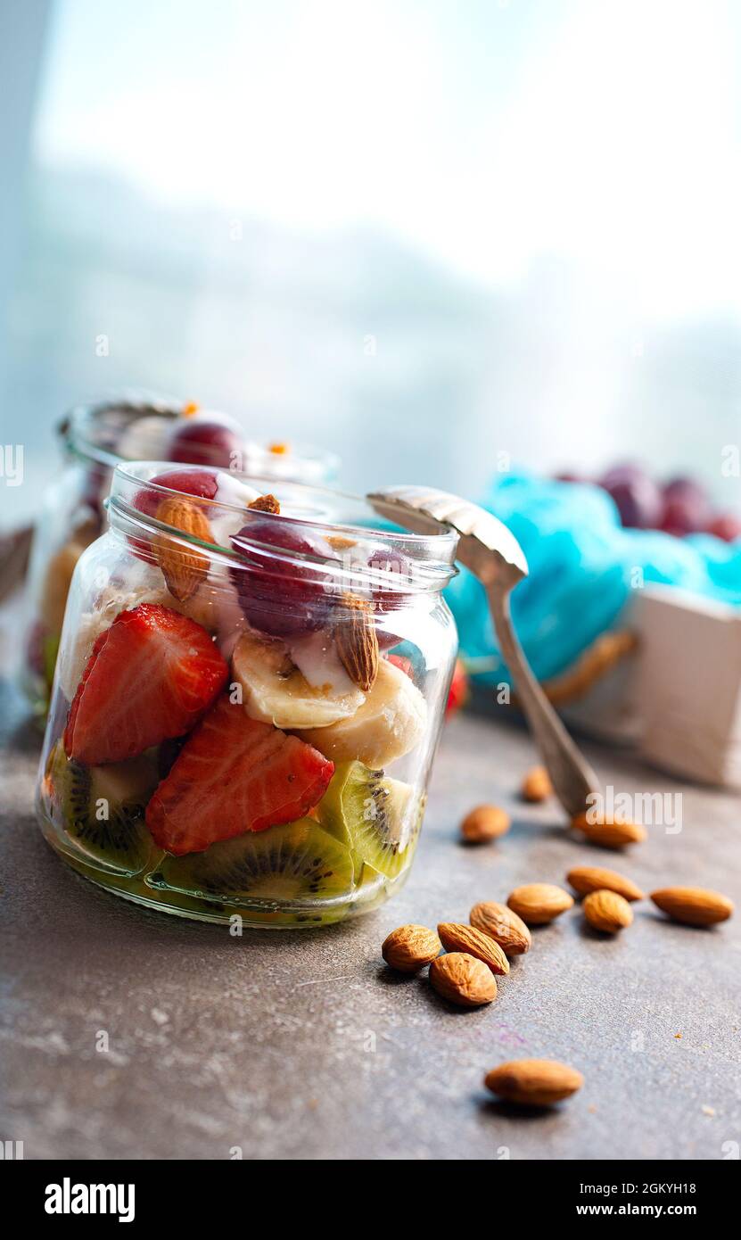 fruit salad with sour cream and nuts Stock Photo - Alamy