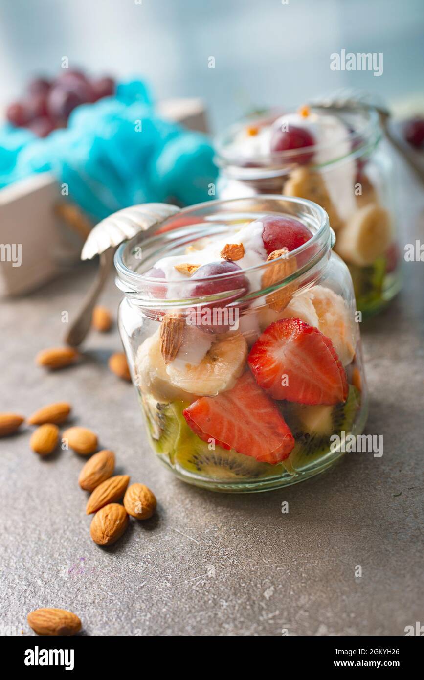 fruit salad with sour cream and nuts Stock Photo - Alamy