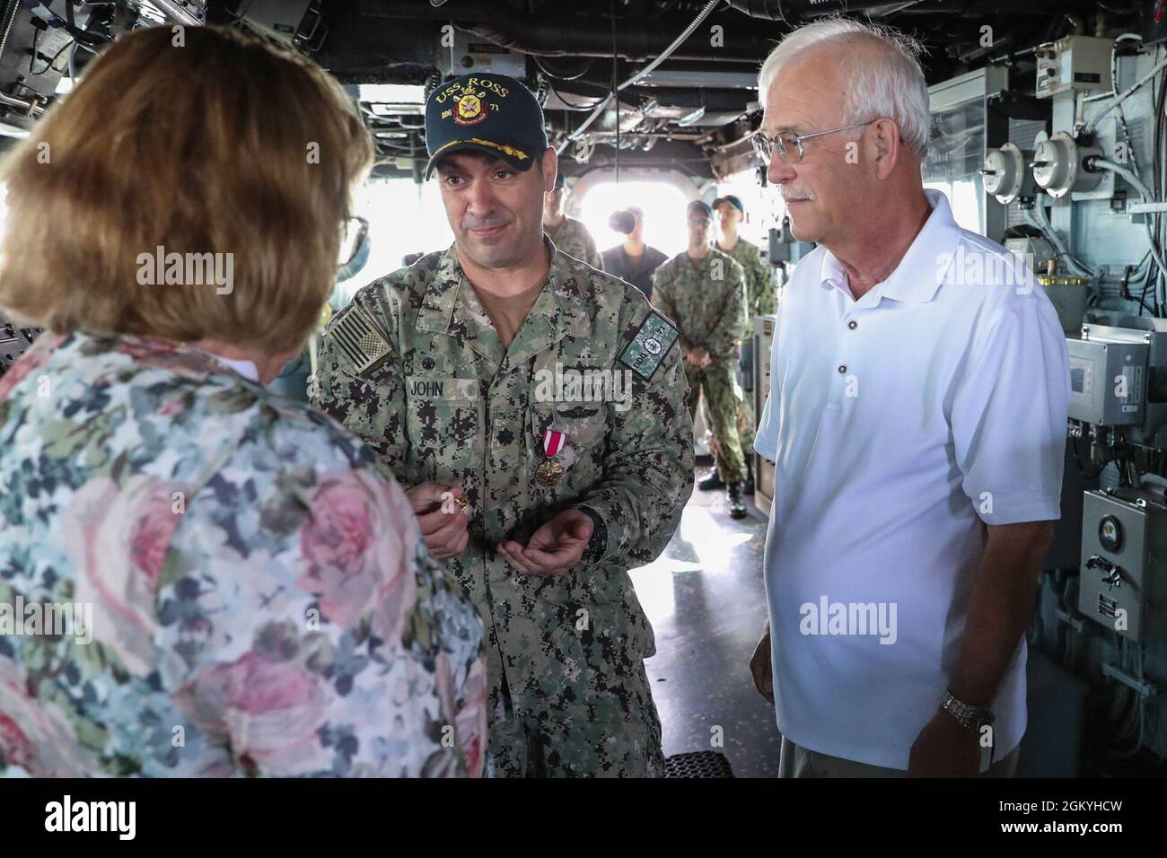 NAVAL STATION ROTA, Spain (July 29, 2021) Cmdr. John D. John, center ...