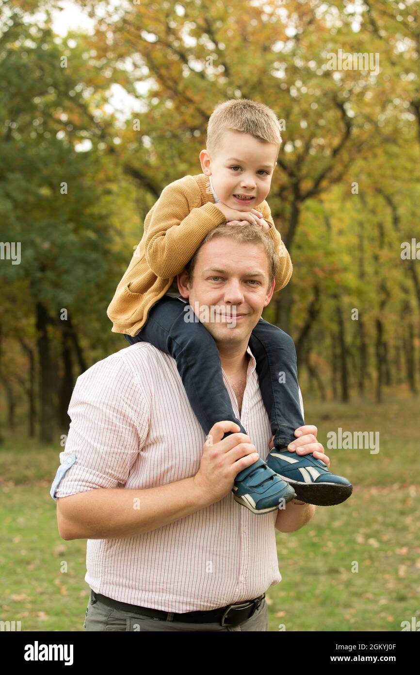 Boy father autumn walk park hi-res stock photography and images - Alamy