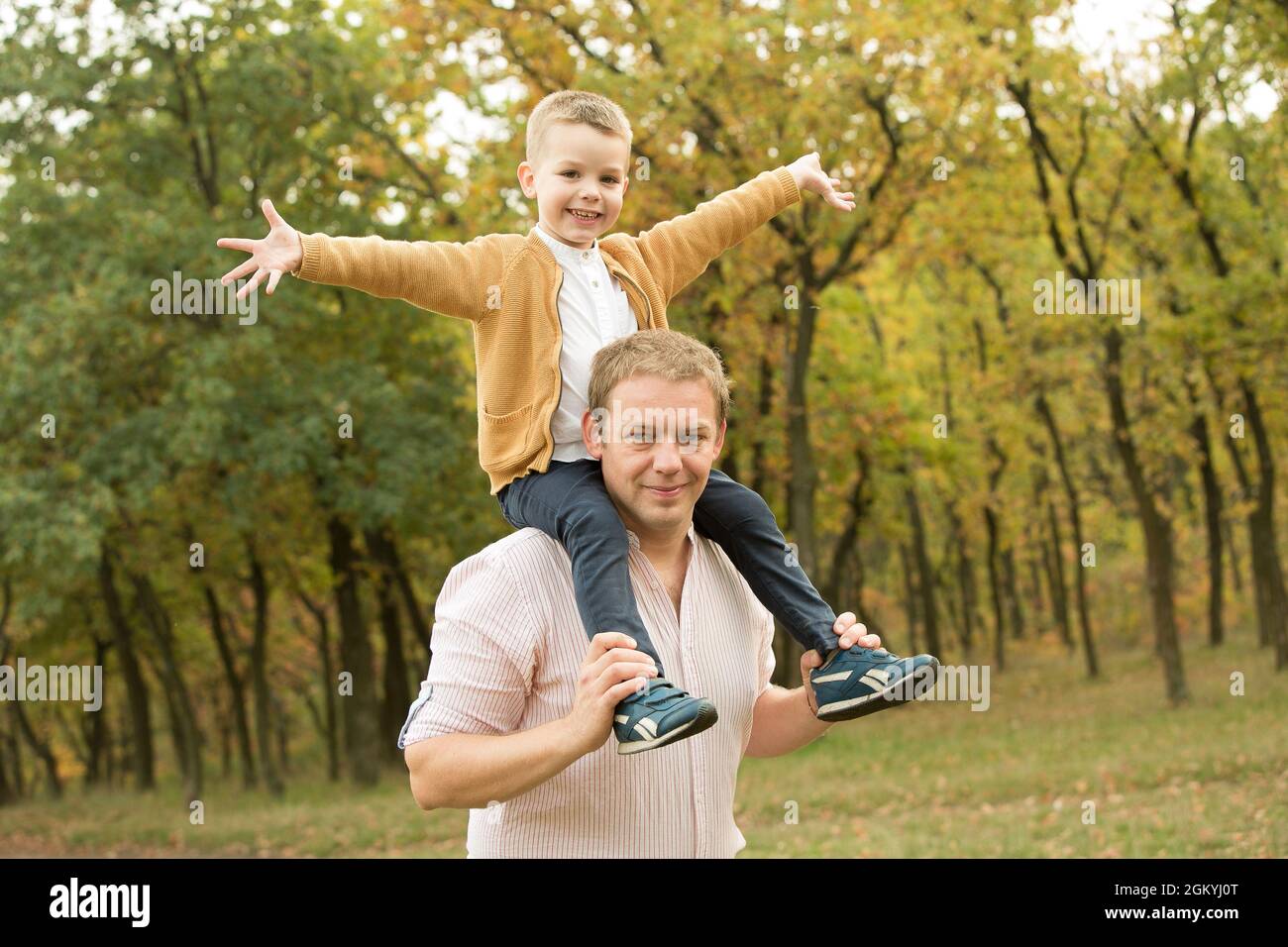 Fall. Close-up of happy and laughing dad and son on the background of ...