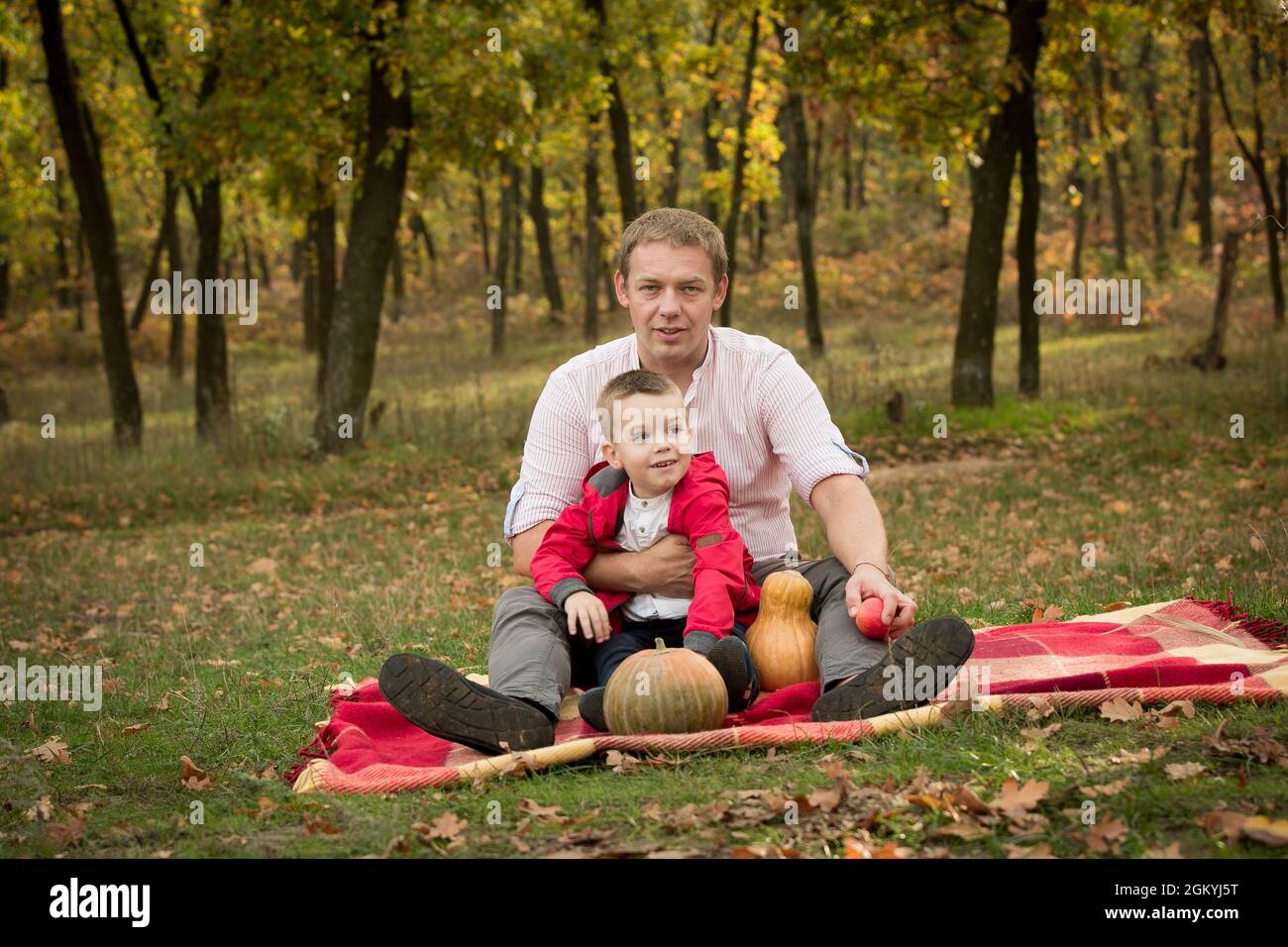 Fall. Close-up of happy and laughing dad and son on the background of ...