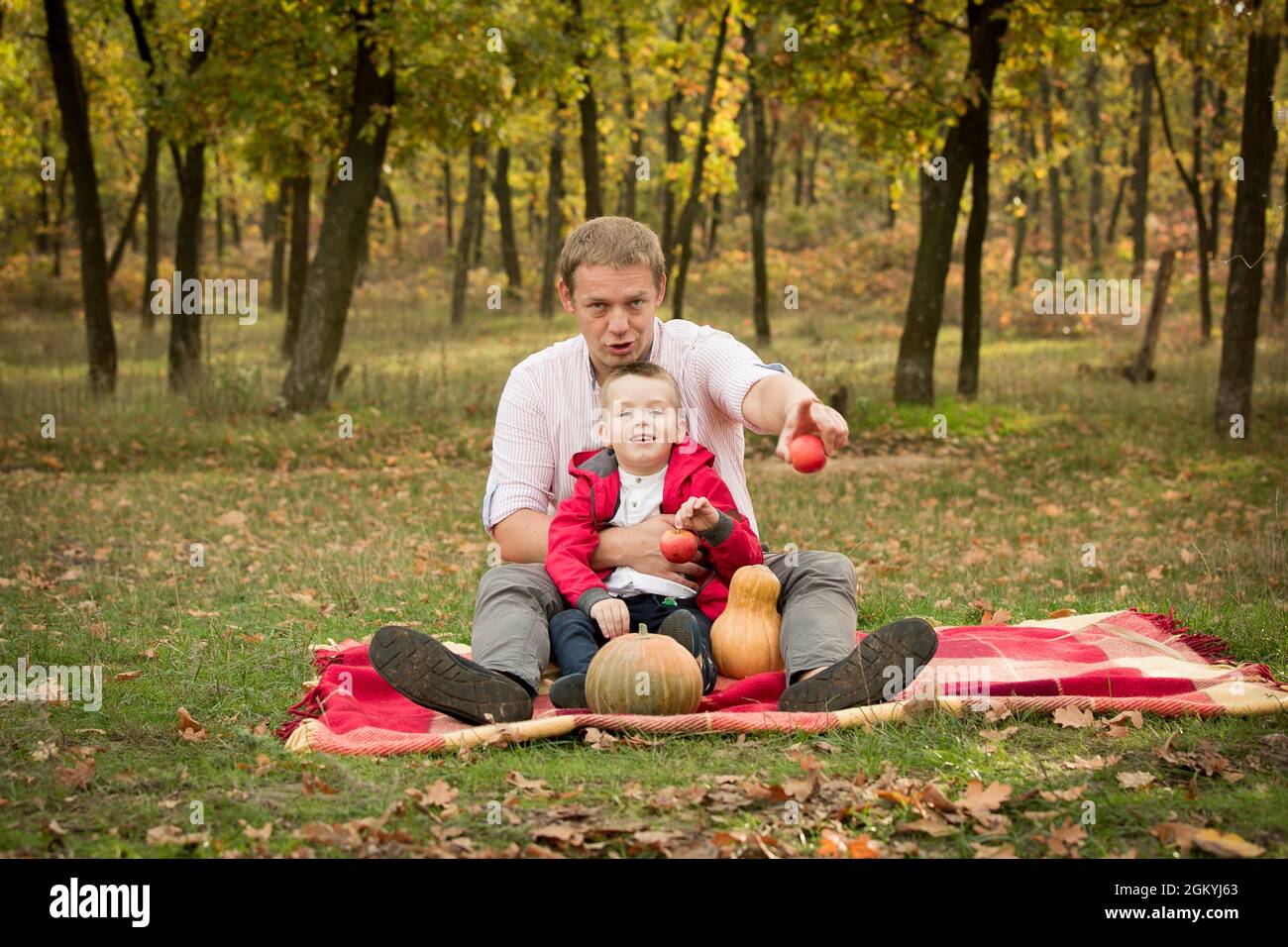 Fall. Close-up of happy and laughing dad and son on the background of ...
