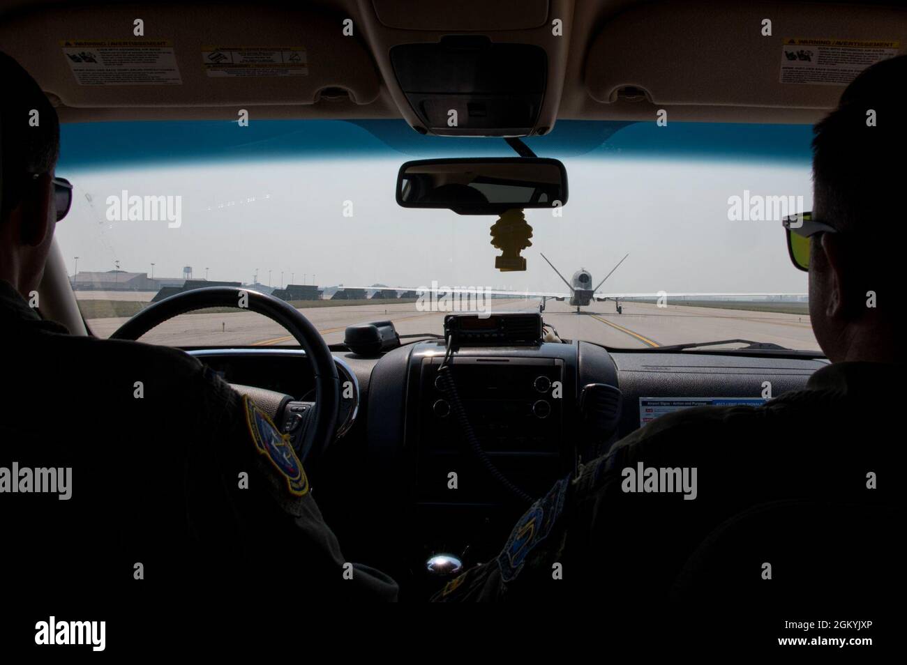 Two 319th Reconnaissance Wing pilots monitor an EQ-4 Global Hawk while ...