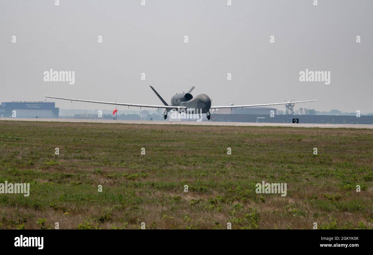 An EQ-4 Global Hawk hovers over the runway during its final landing at ...