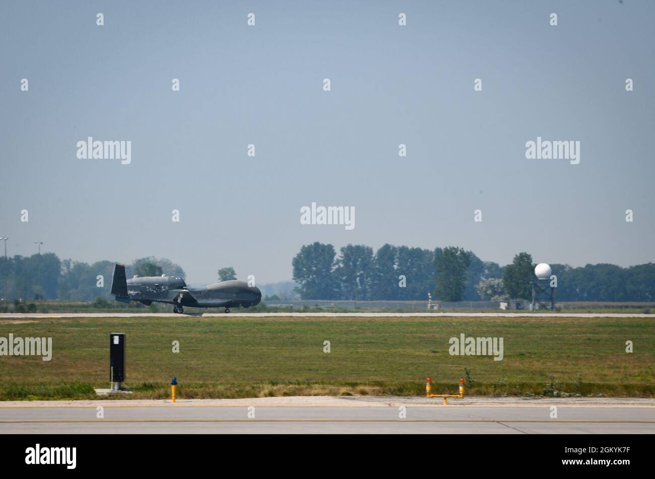 An EQ-4 Block-20 Global Hawk taxis down the runway to conclude its ...