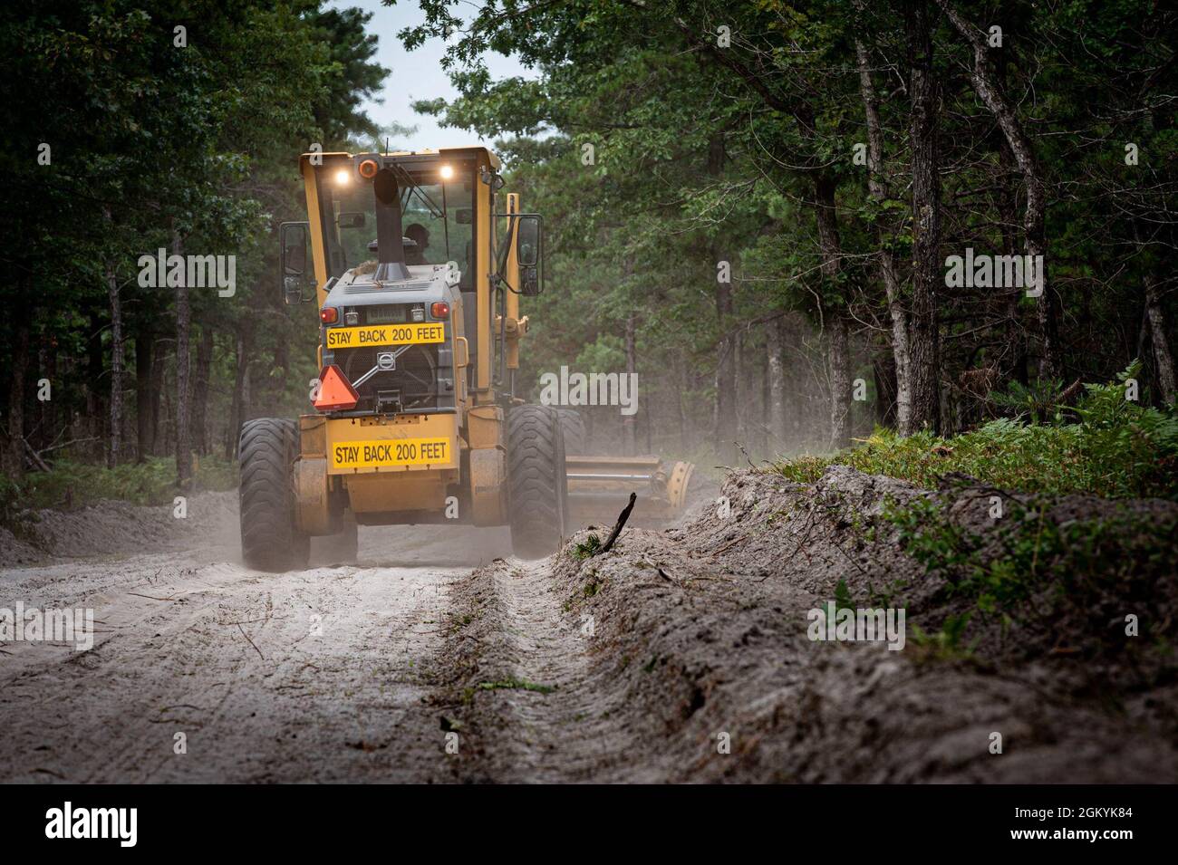 Range support personnel perform fire break maintenance at Joint Base ...