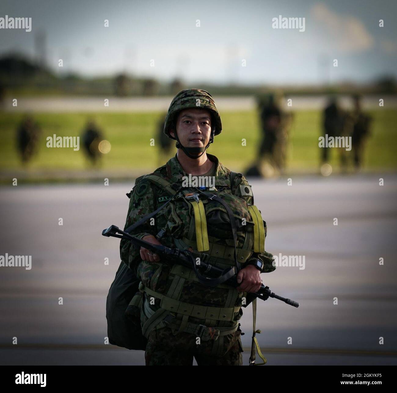A Soldier from the Japan Ground Self-Defense Force rucks toward a ...
