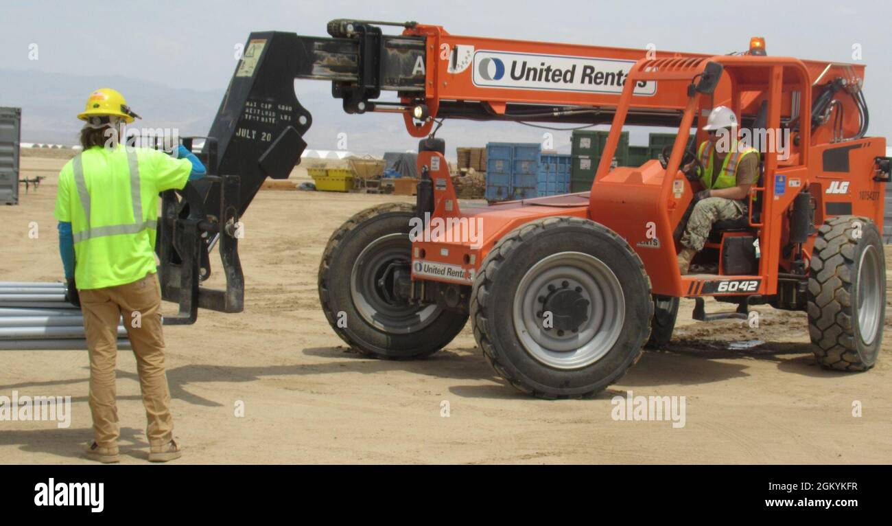 Seabee from Naval Mobile Construction Battalion FOUR (NMCB 4) unloading ...