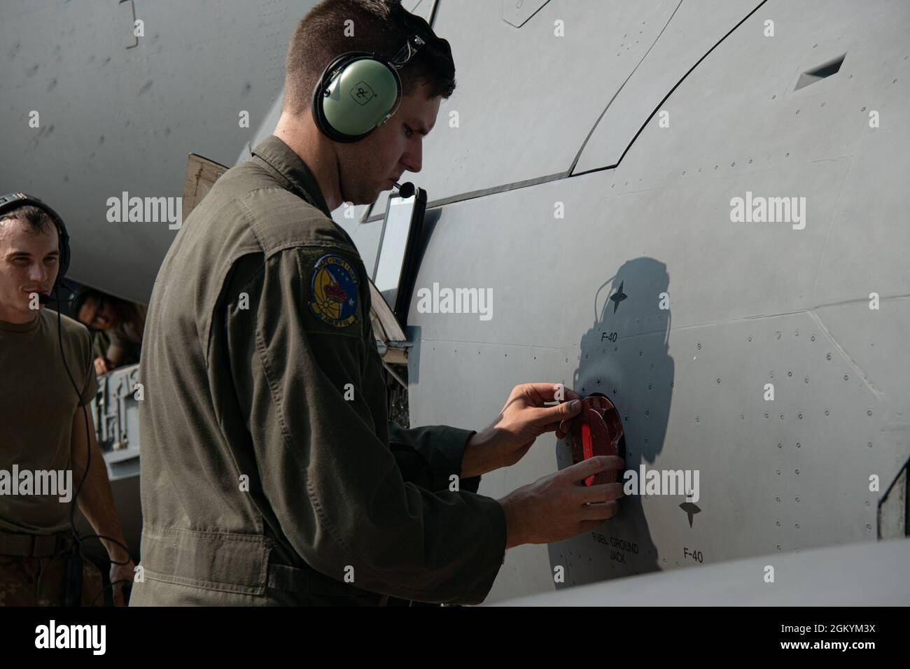 Staff Sgt. Morgen Sindelar, 3rd Airlift Squadron loadmaster, secures a ...