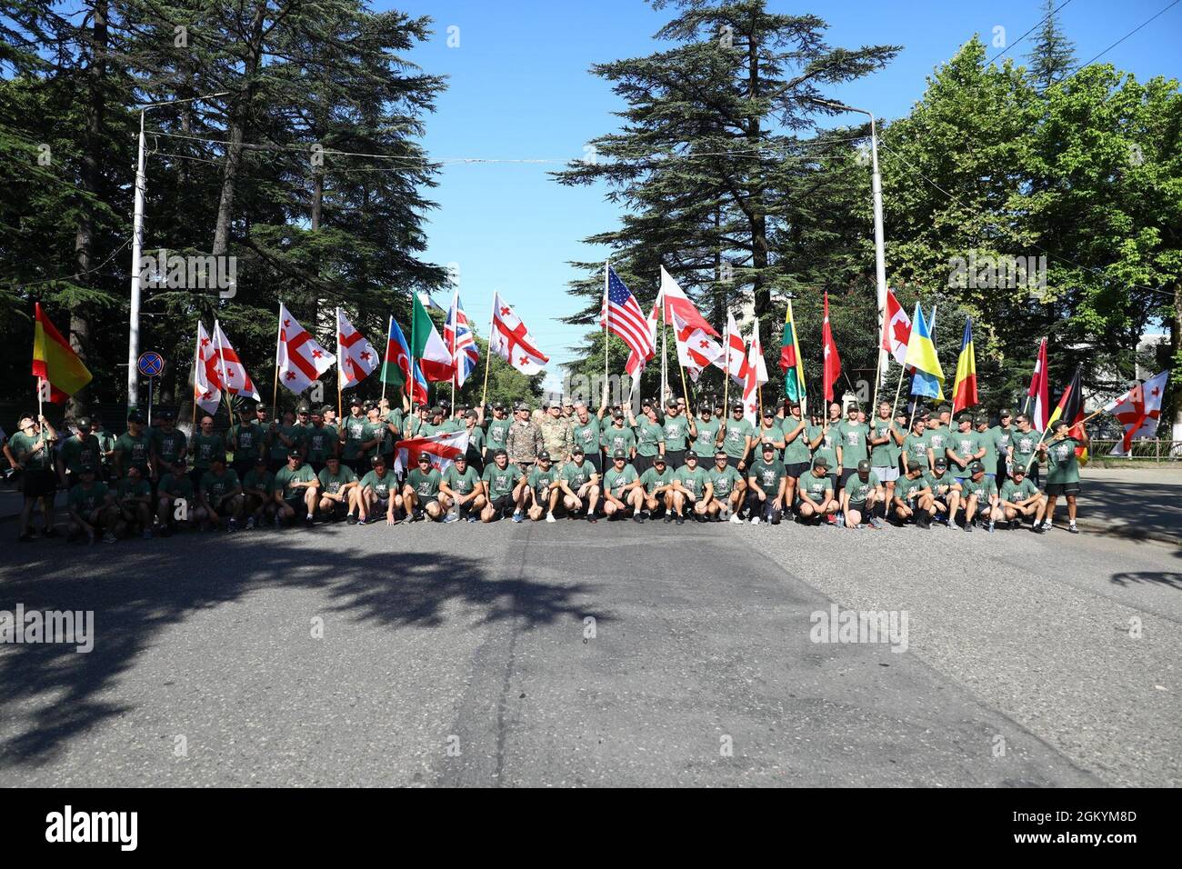 Coalition soldiers stand for a group photo after completing a race to ...
