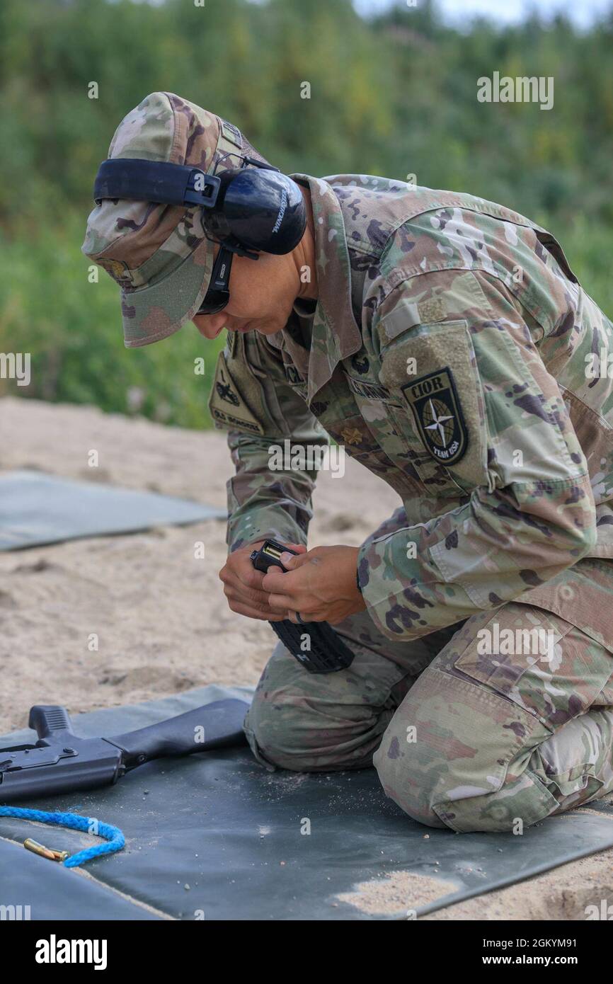 Maj. Nicole Dallocchio, U.S. Army Reserve Command, reloads a SAR-M1 ...