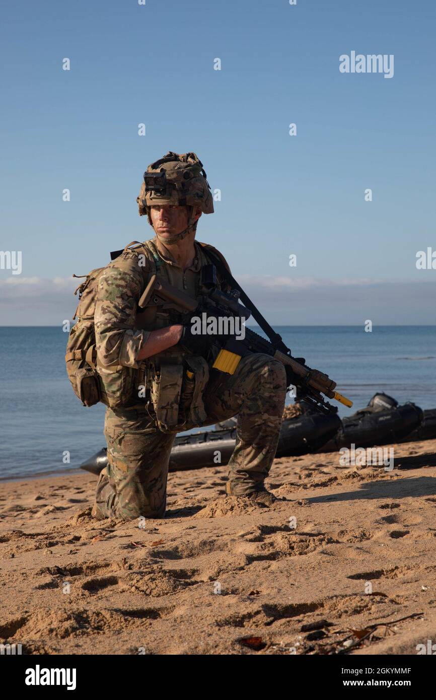 A British Royal Marine, with 40 Commando, post security during an ...