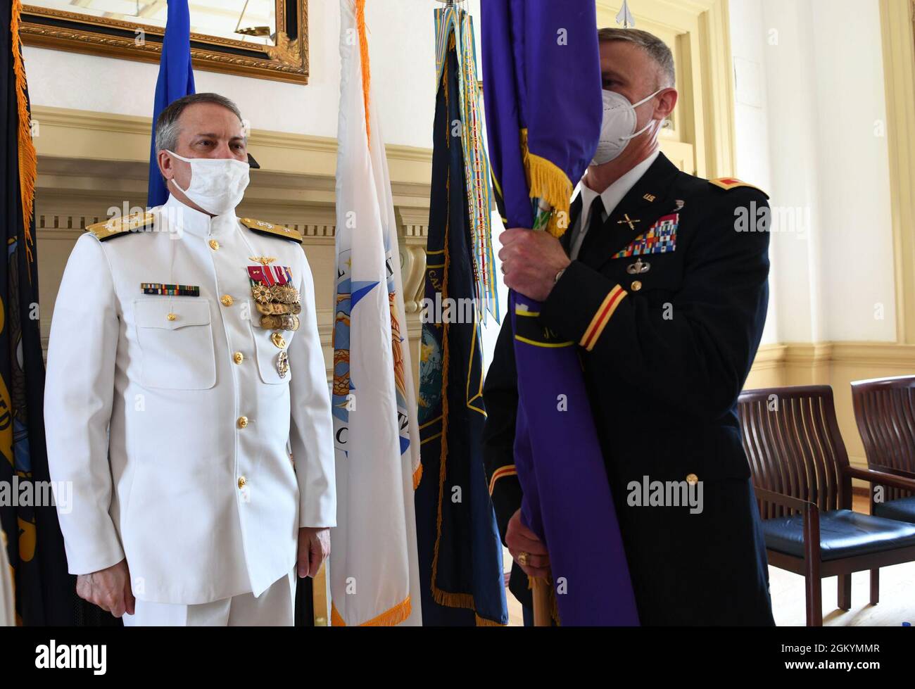 U.S. Army Col. William Kirby, right, passes the colors during the Joint Planning Support Element ...