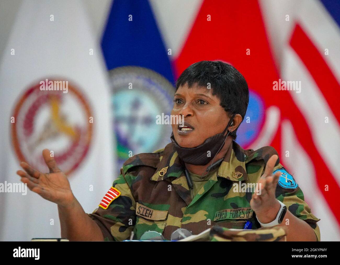 A member of the Armed Forces of Liberia (AFL) engages in discussions ...