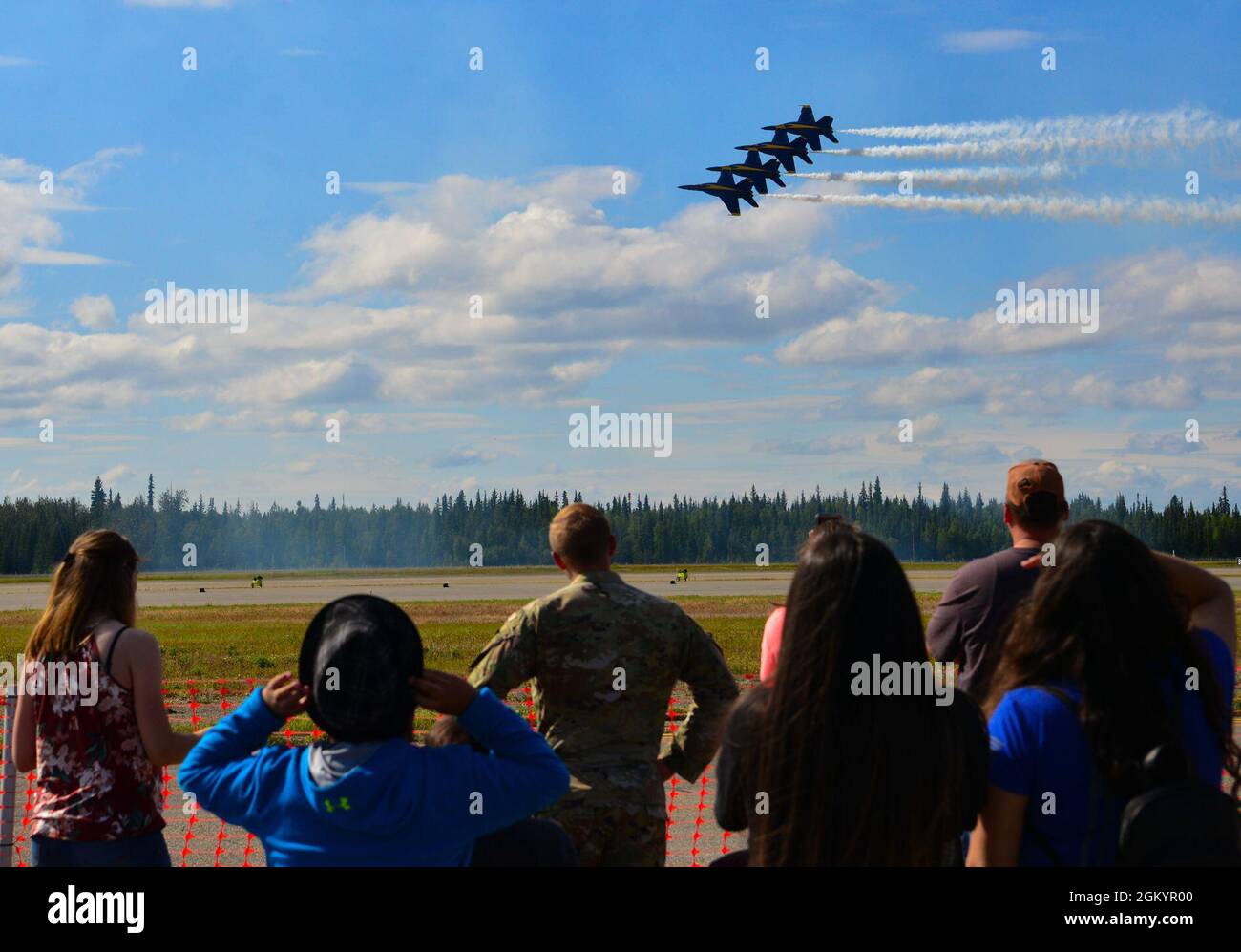 A crowd watches the U.S. Navy Air Demonstration Squadron, the Blue ...