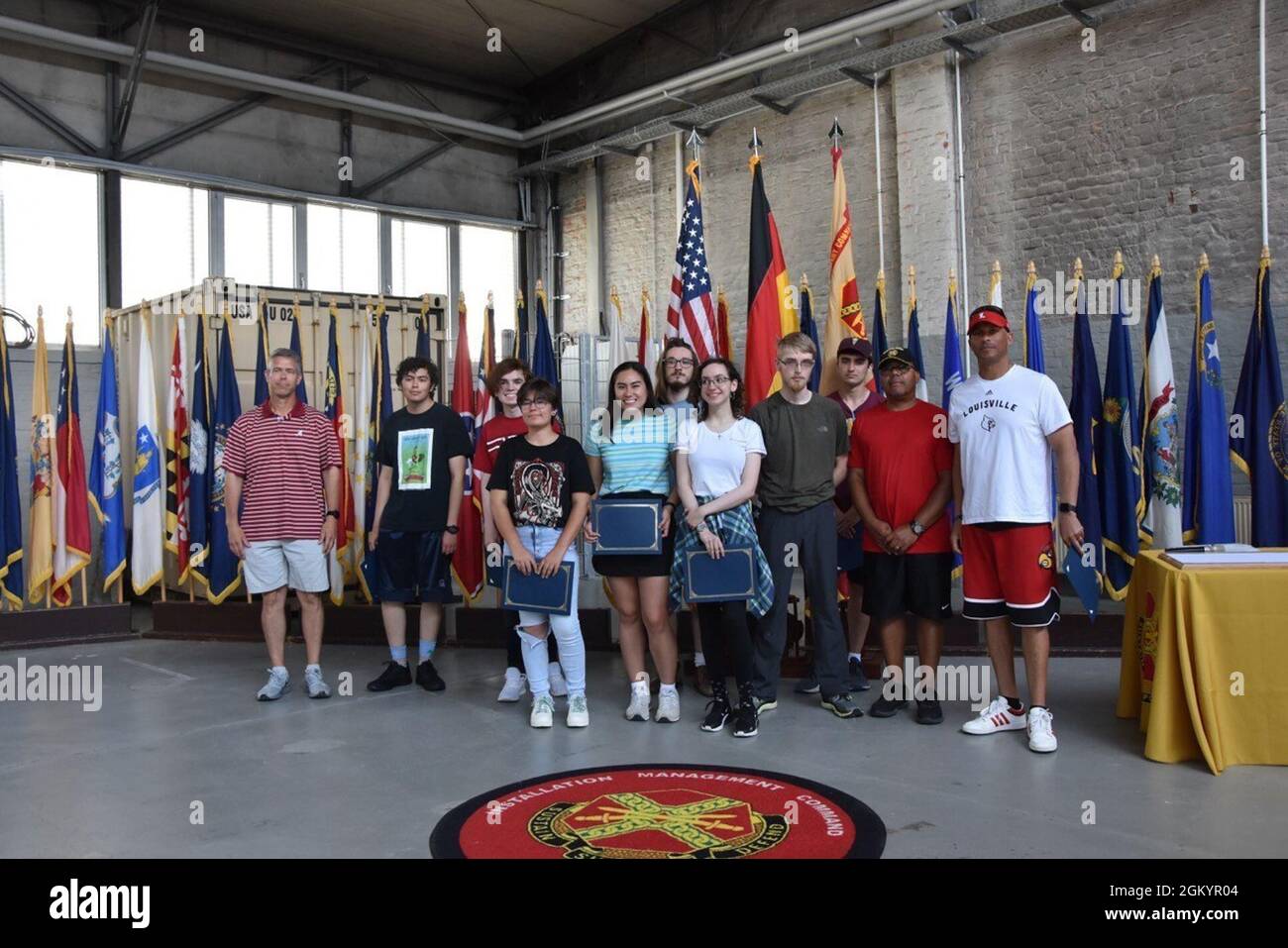 The group of Wiesbaden Garrison summer hires pose with their ...
