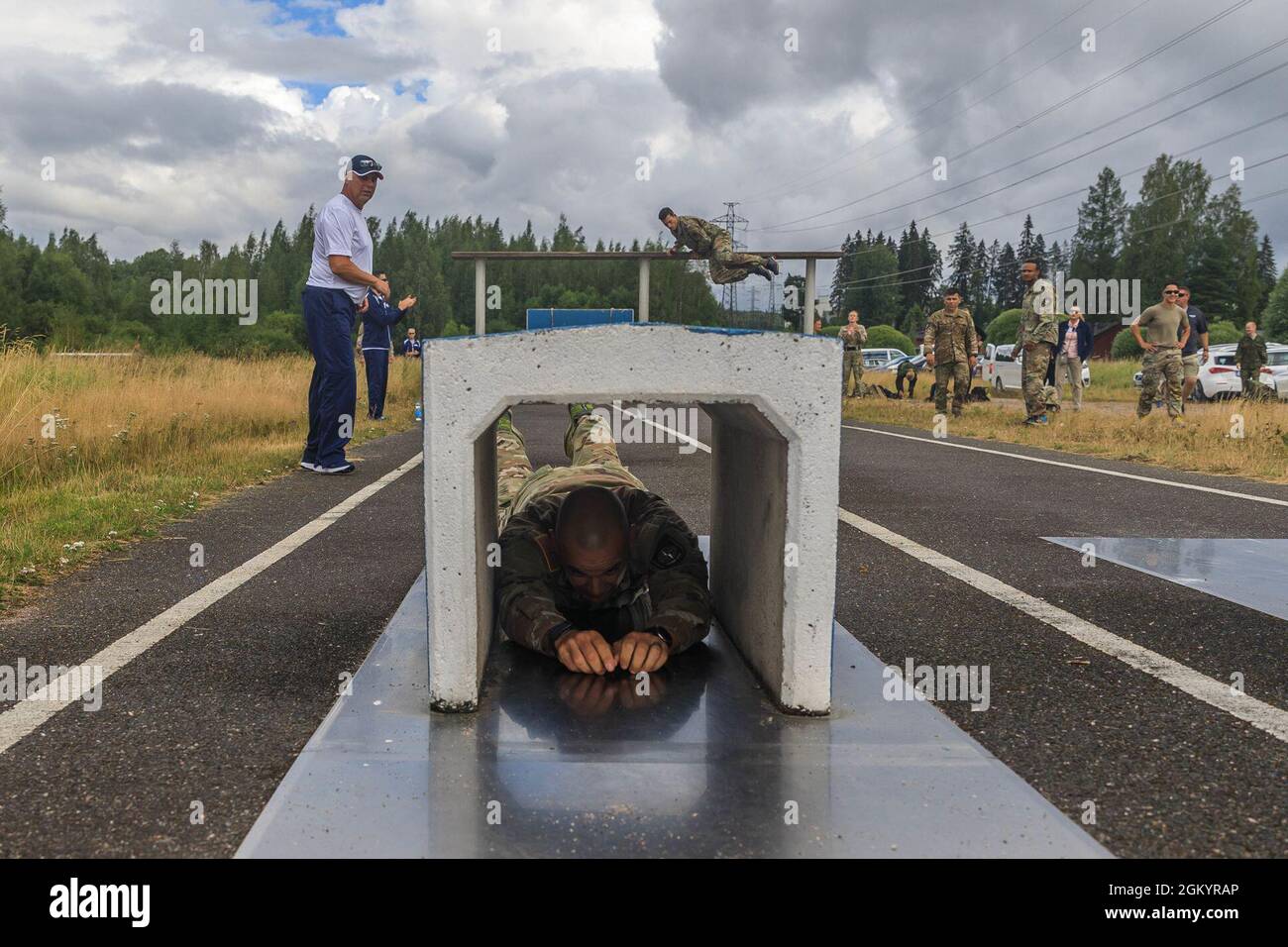 Staff Sgt. Devin Crawford, 108th Training Command, slides through an ...