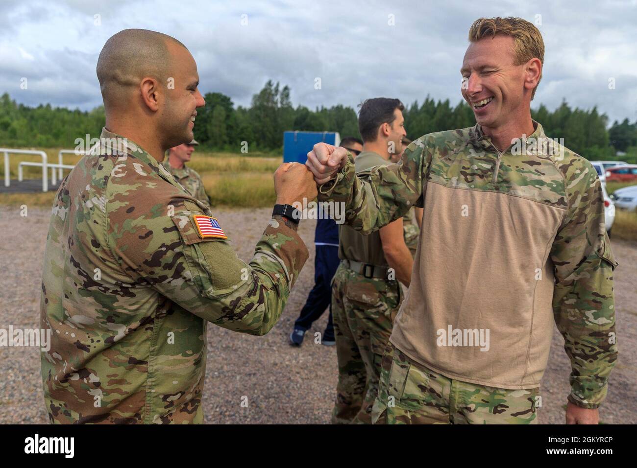 Staff Sgt. Devin Crawford, 108th Training Command, congratulates Rasmus ...