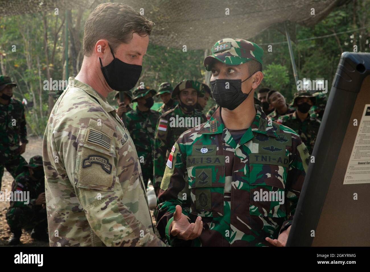A U.S. Army Soldier, with Task Force Warrior, and one of his Tentara ...