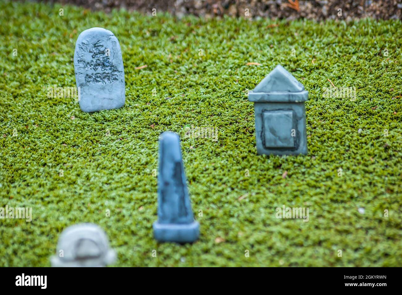 Closeup of tiny model gravestones in a graveyard at a model village ...