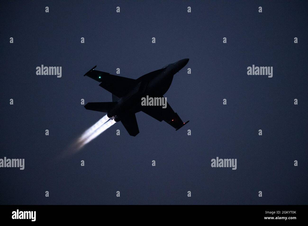 A U.S. Navy EA-18G Growler electronic warfare aircraft performs a high ...