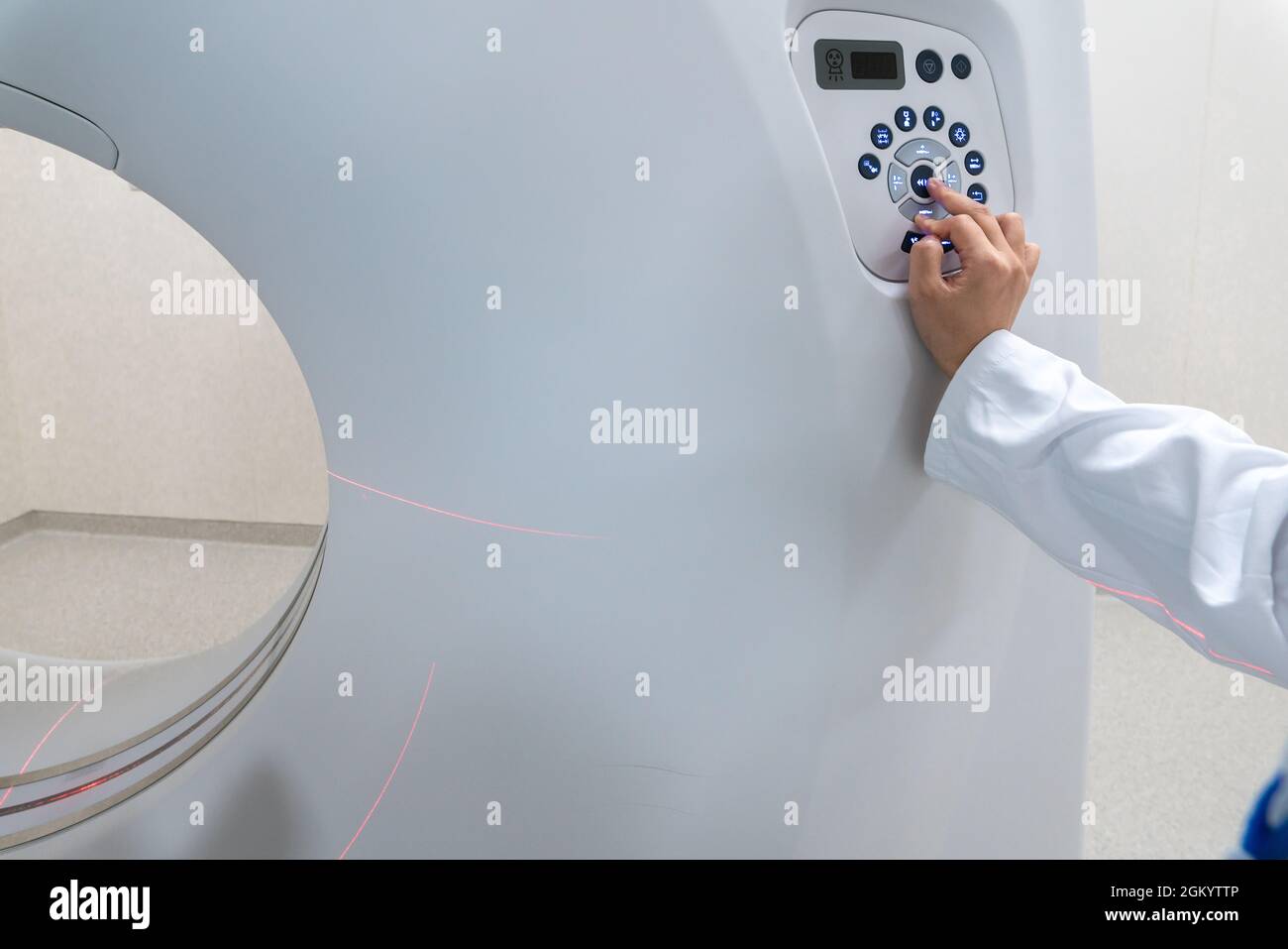 Doctor's hand manipulating the buttons of a high end Computerized ...