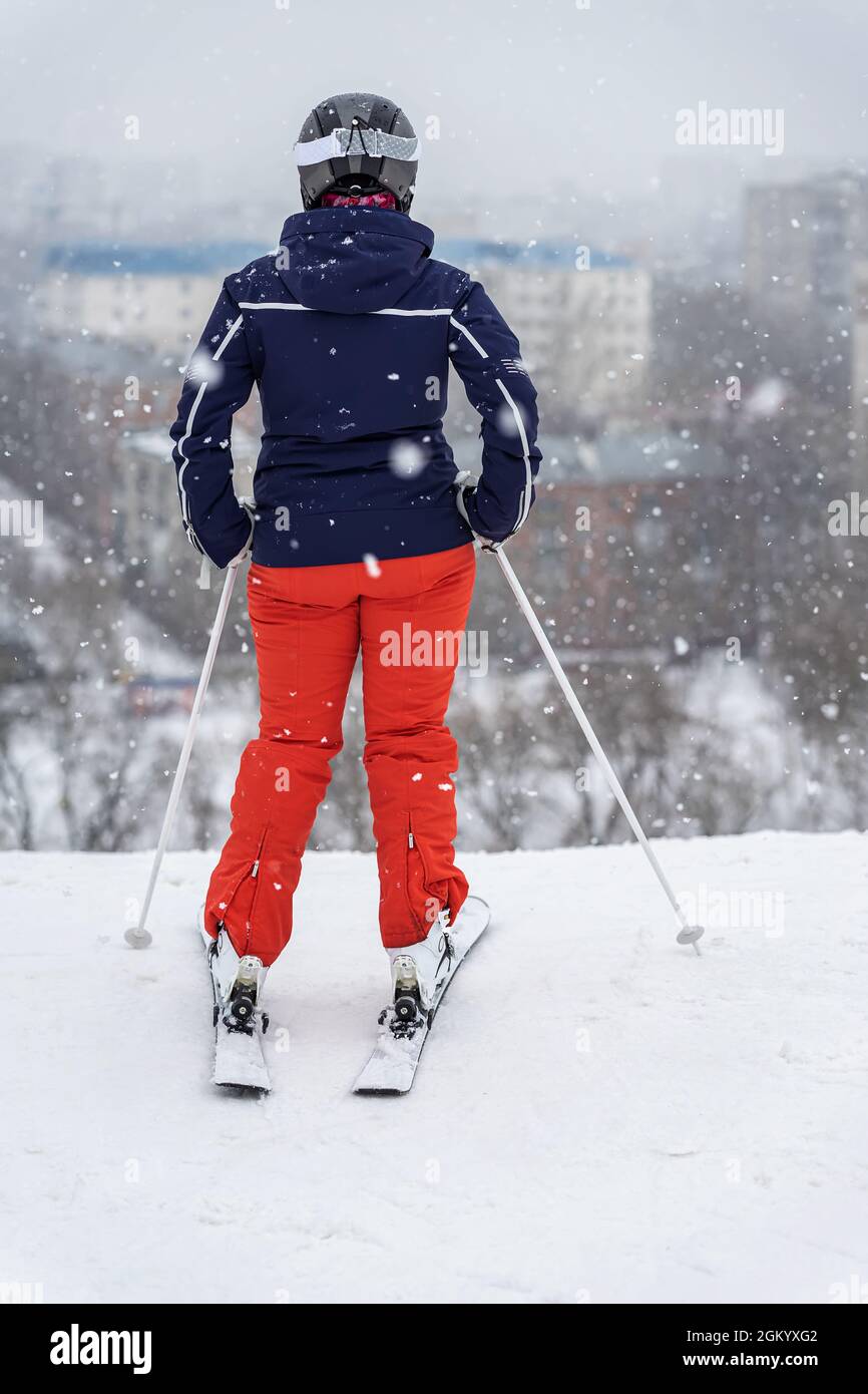 Female skier standing on slope hi-res stock photography and images - Alamy