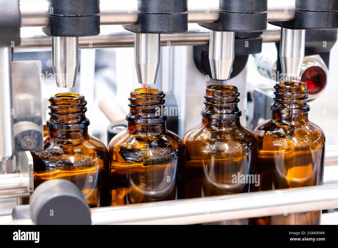 Bottles on the production line conveyor of the pharmaceutical industry ...