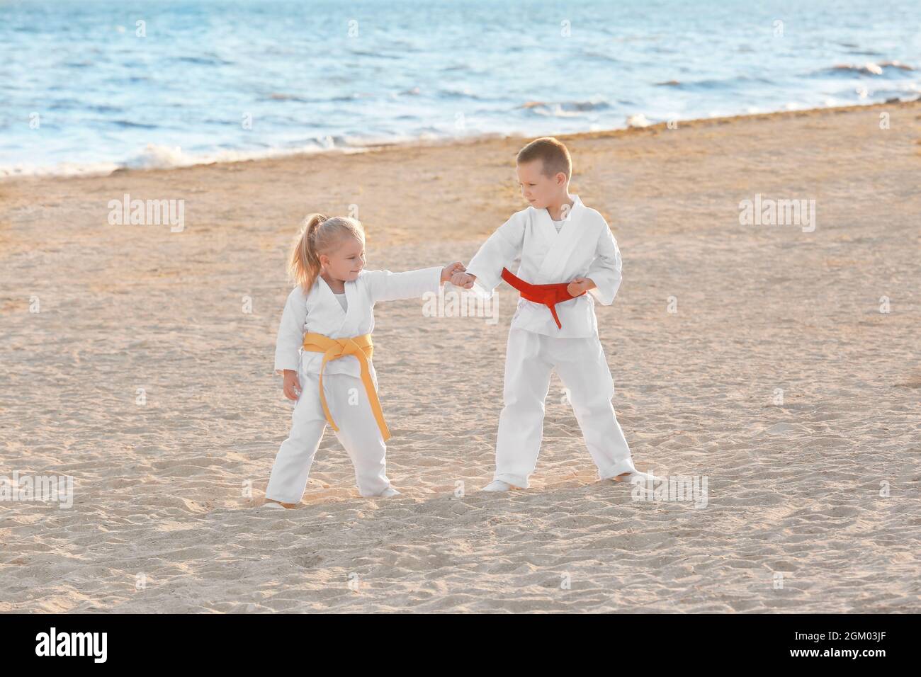 Little children practicing karate outdoors Stock Photo - Alamy