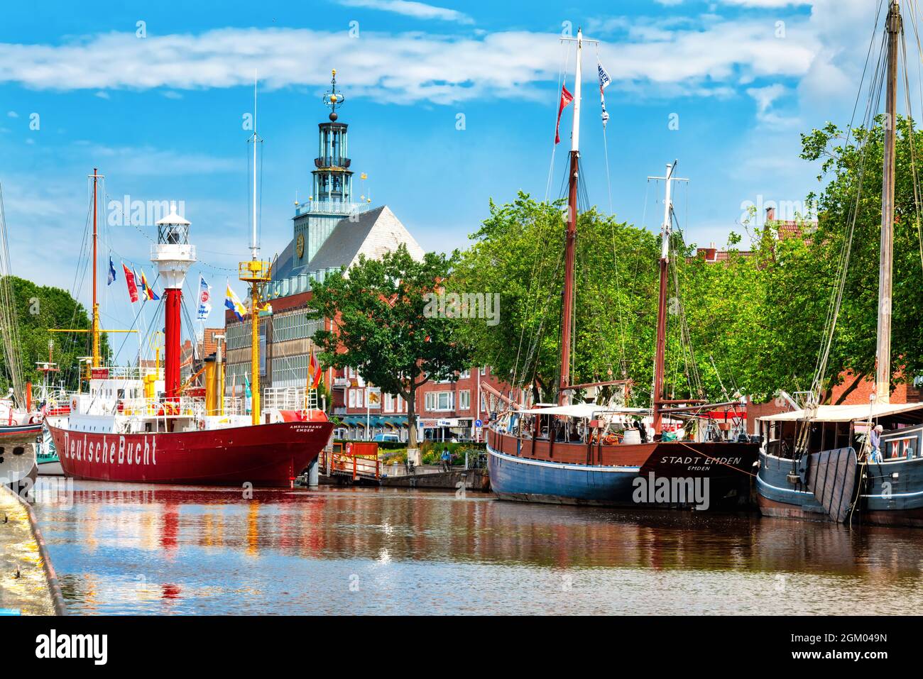 Harbor of Emden city with city hall, historic light vessel and sailship ...