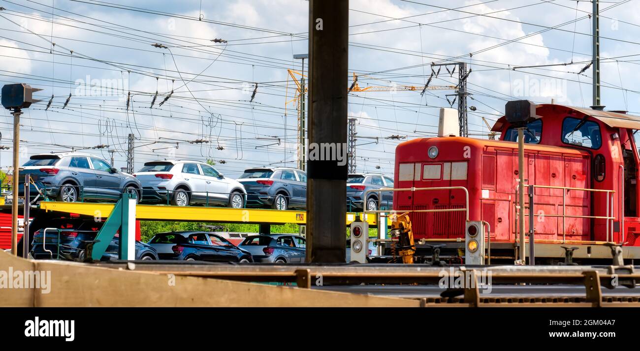 Transportation of cars by train. Autorack with cars. Loaded cars ready ...