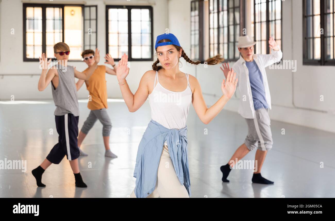 Teenage girl practicing active dance at studio Stock Photo - Alamy