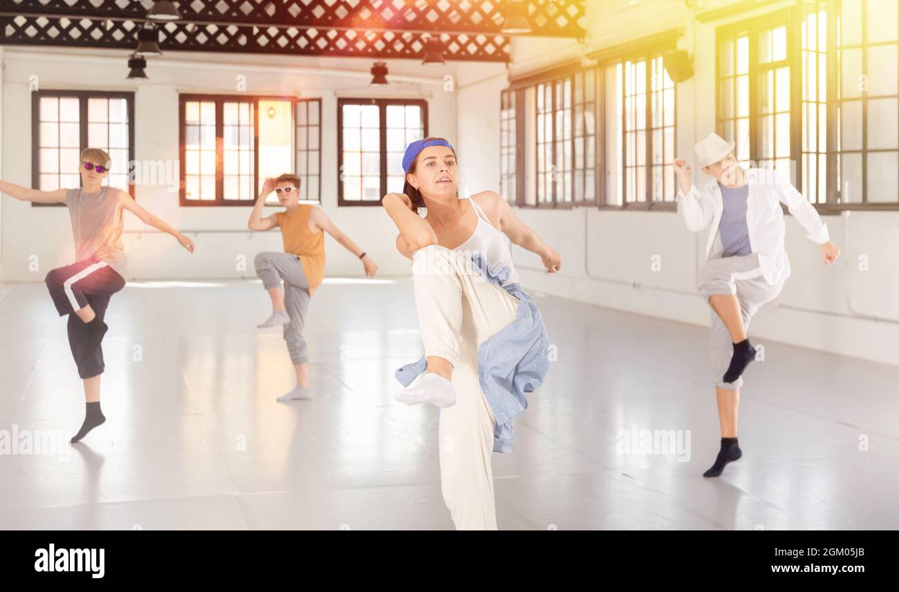 Teenage dancers practicing active dance at studio Stock Photo - Alamy