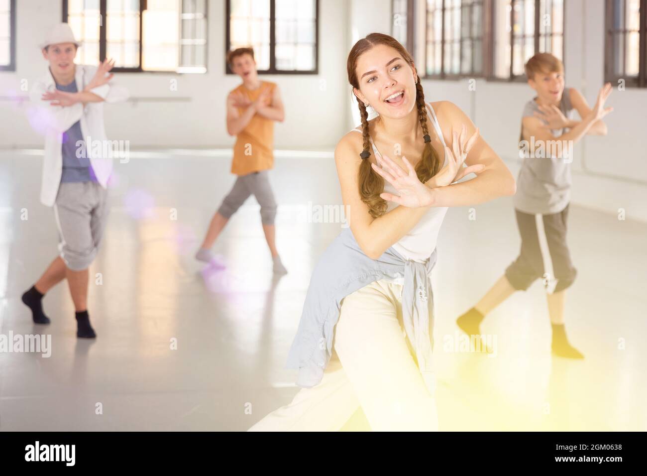 Teenage girl practicing active dance at studio Stock Photo - Alamy