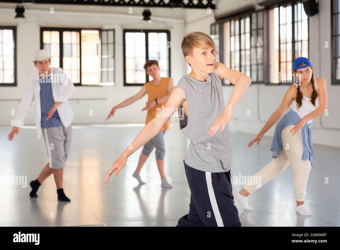 Teenage boy practicing active dance at studio Stock Photo - Alamy