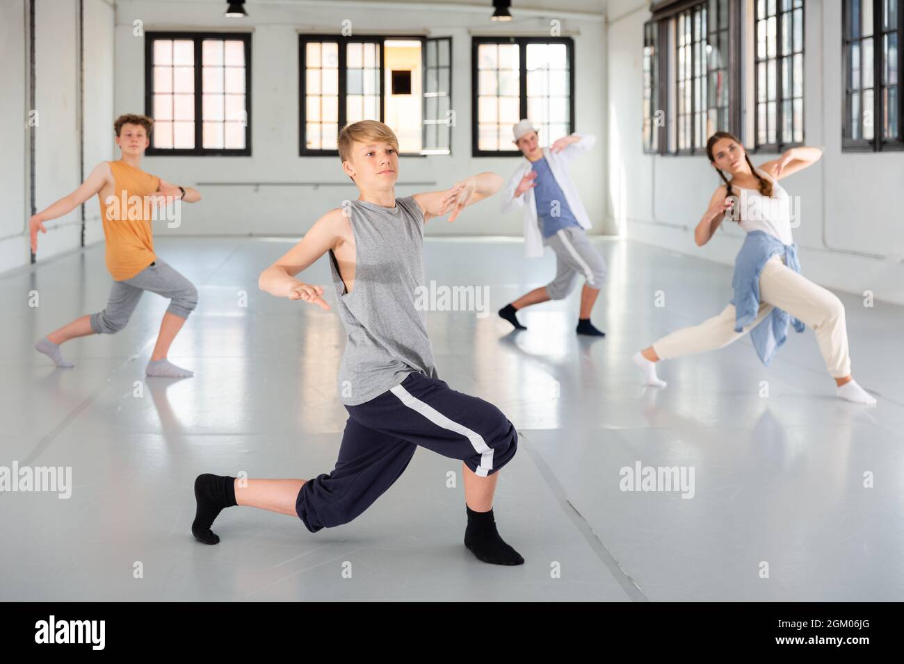 Group of young artists performing street dance Stock Photo - Alamy