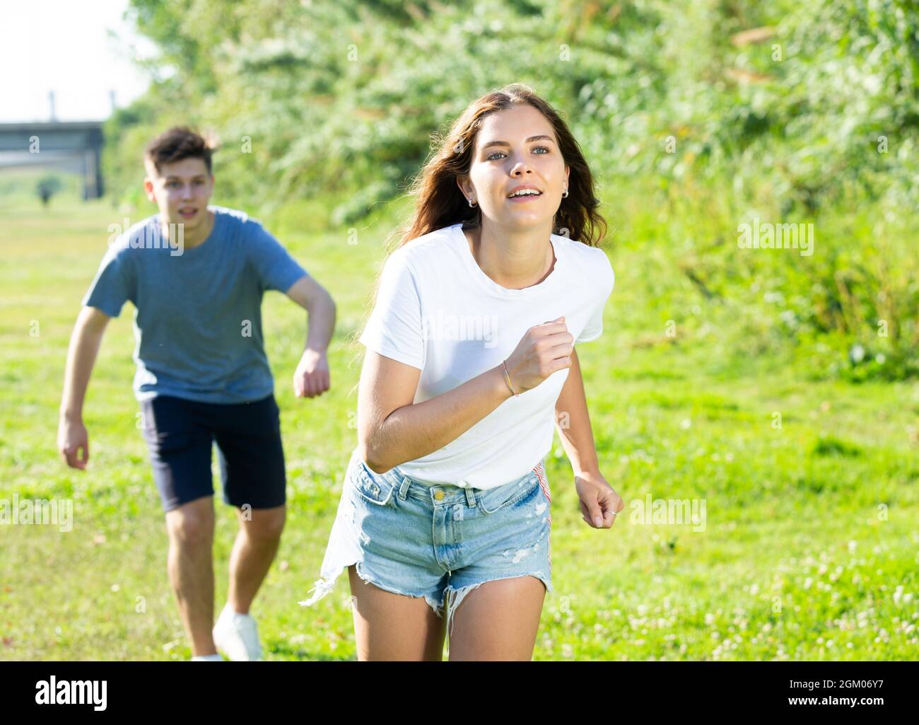 Two teenagers running boy girl hi-res stock photography and images - Alamy