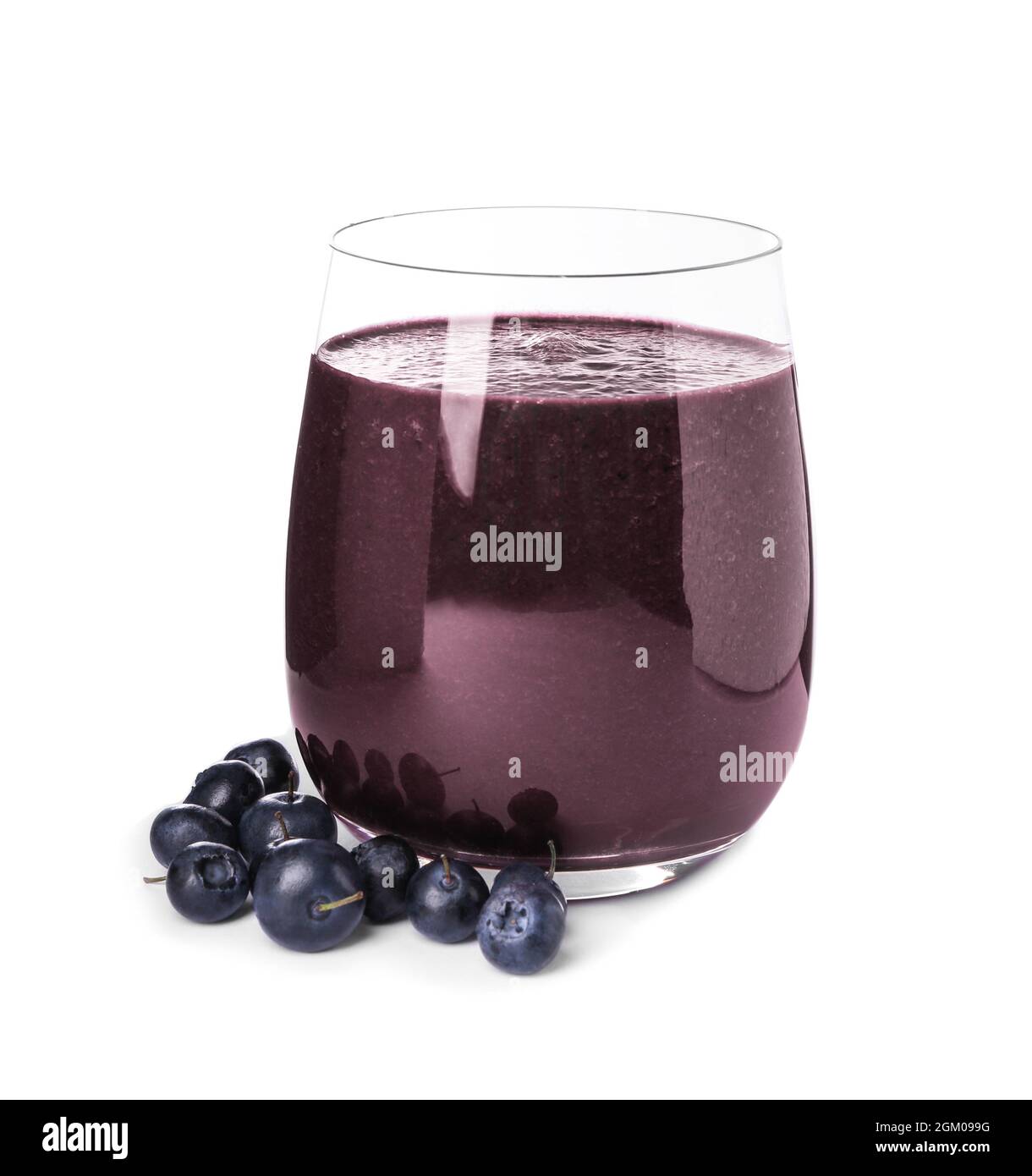 Glass with acai juice and berries on white background Stock Photo - Alamy