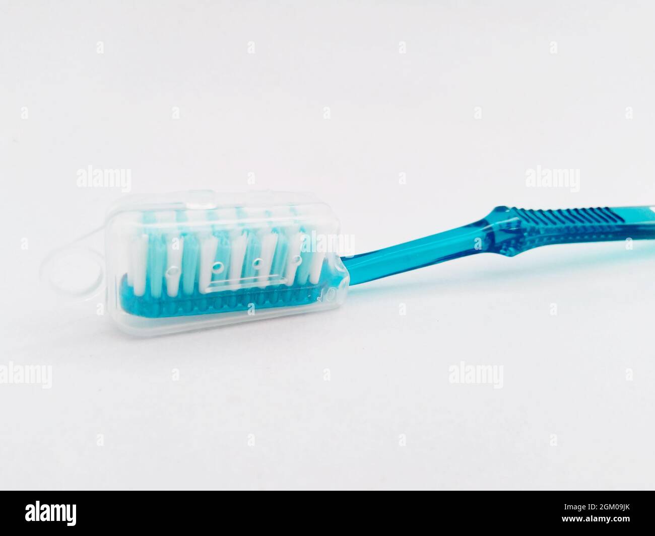 Used toothbrush on an isolated white background Stock Photo - Alamy