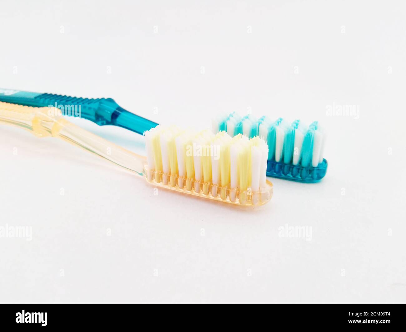 Used toothbrush on an isolated white background Stock Photo - Alamy