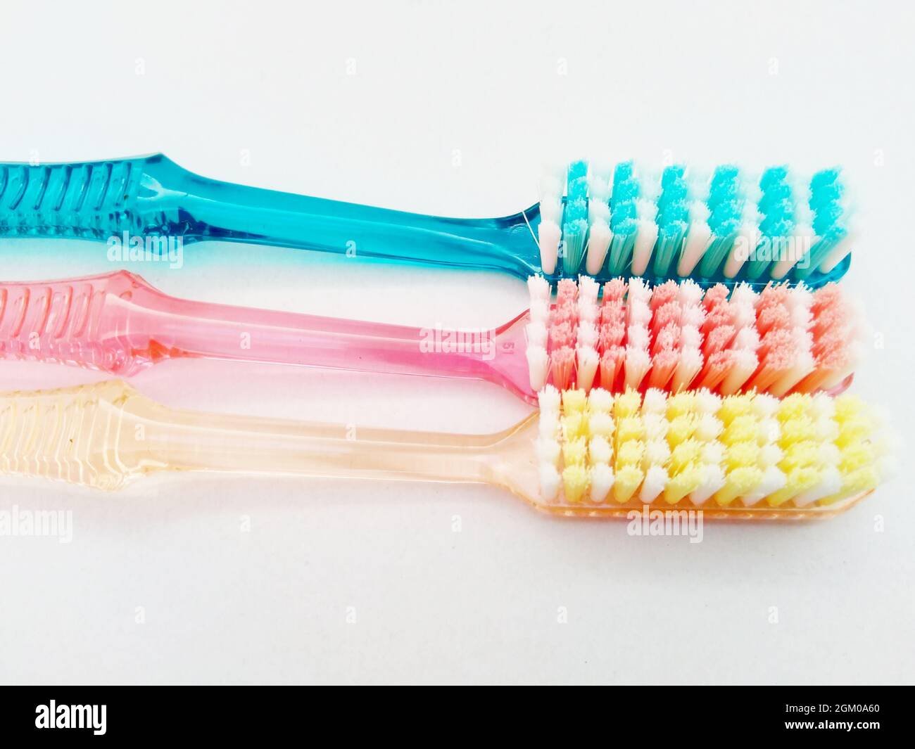 Used toothbrush on an isolated white background Stock Photo - Alamy