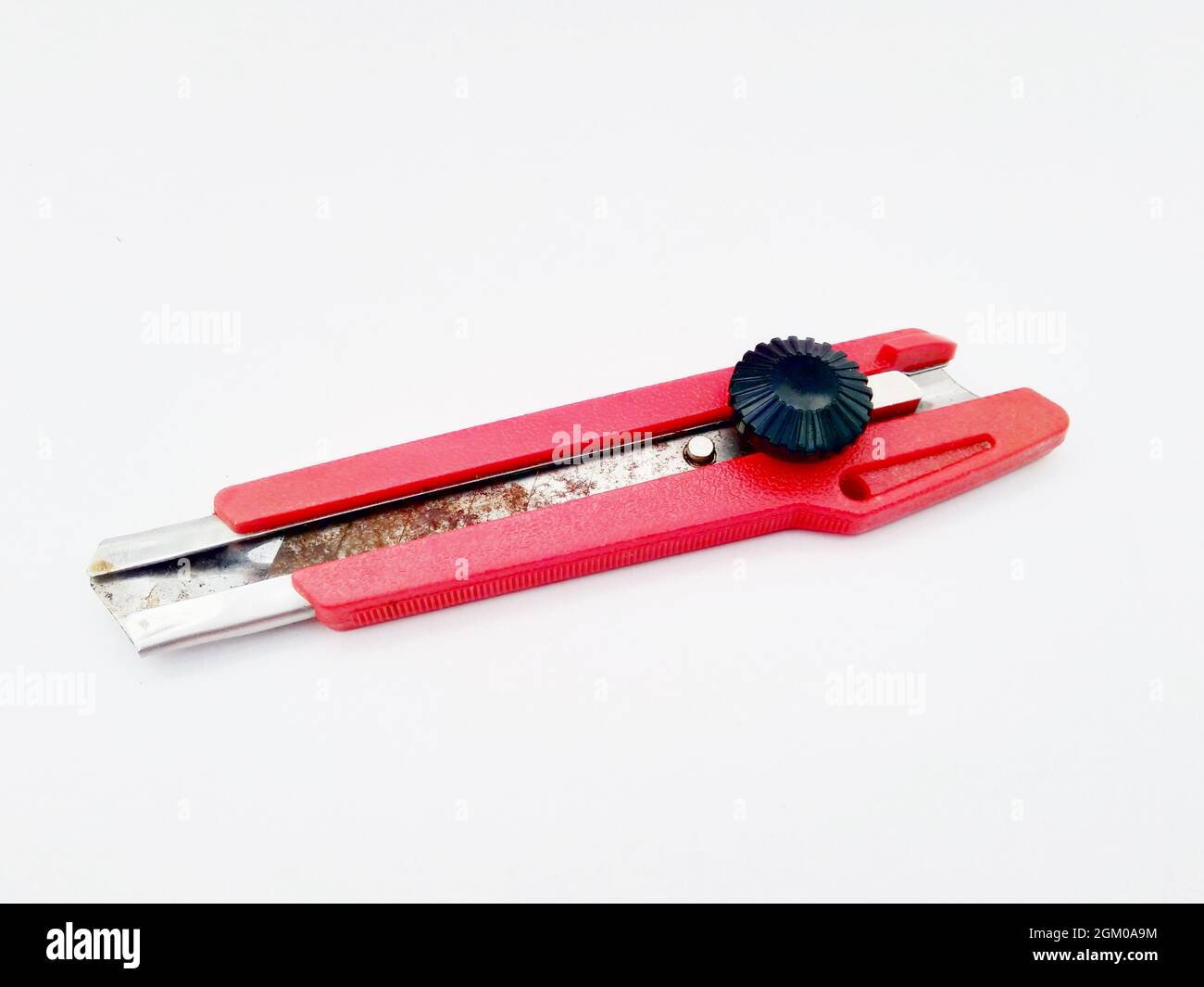 Used cutter on an isolated white background Stock Photo - Alamy