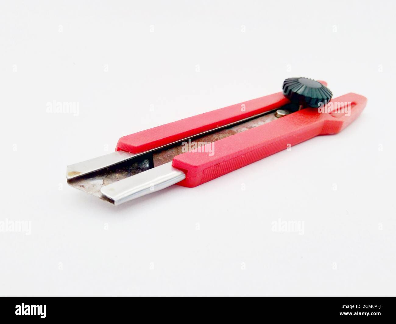 Used cutter on an isolated white background Stock Photo - Alamy