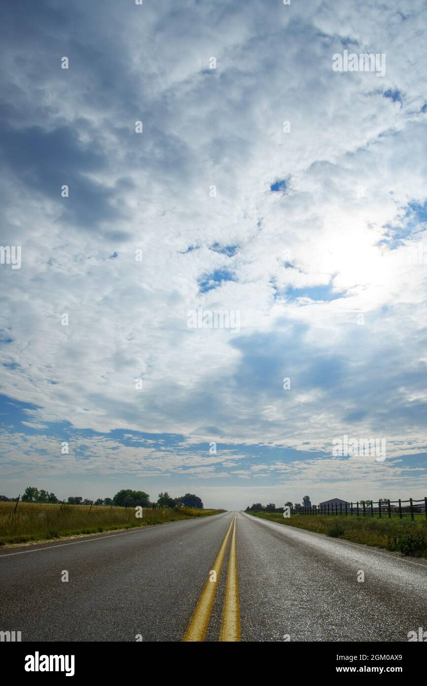 Road with clouds on horizon Stock Photo - Alamy