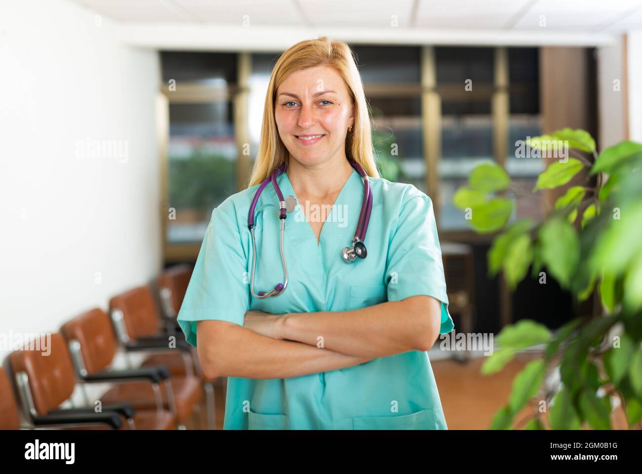 Female doctor assistant standing in medical office Stock Photo - Alamy