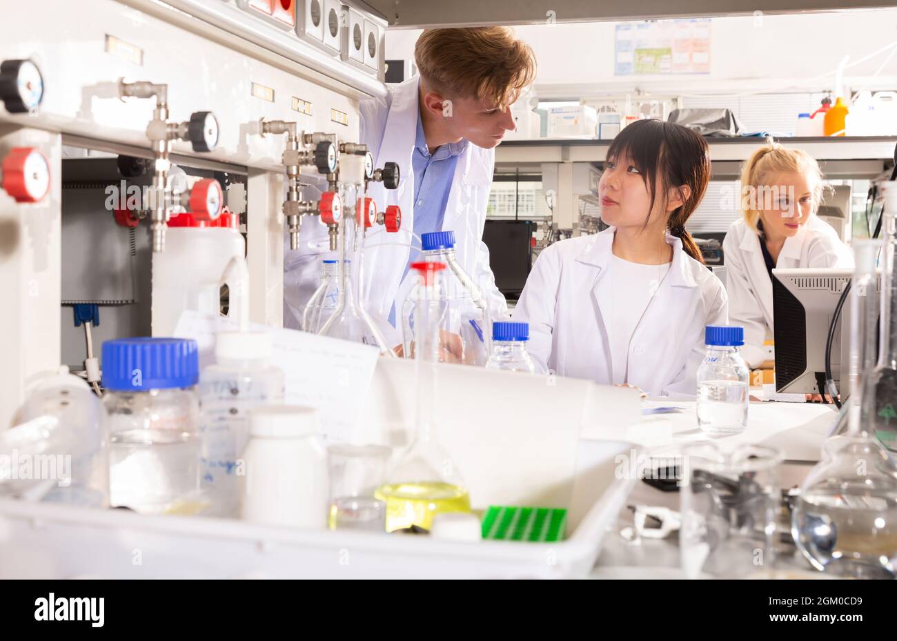 Chinese female student with male recording results of experiments Stock ...
