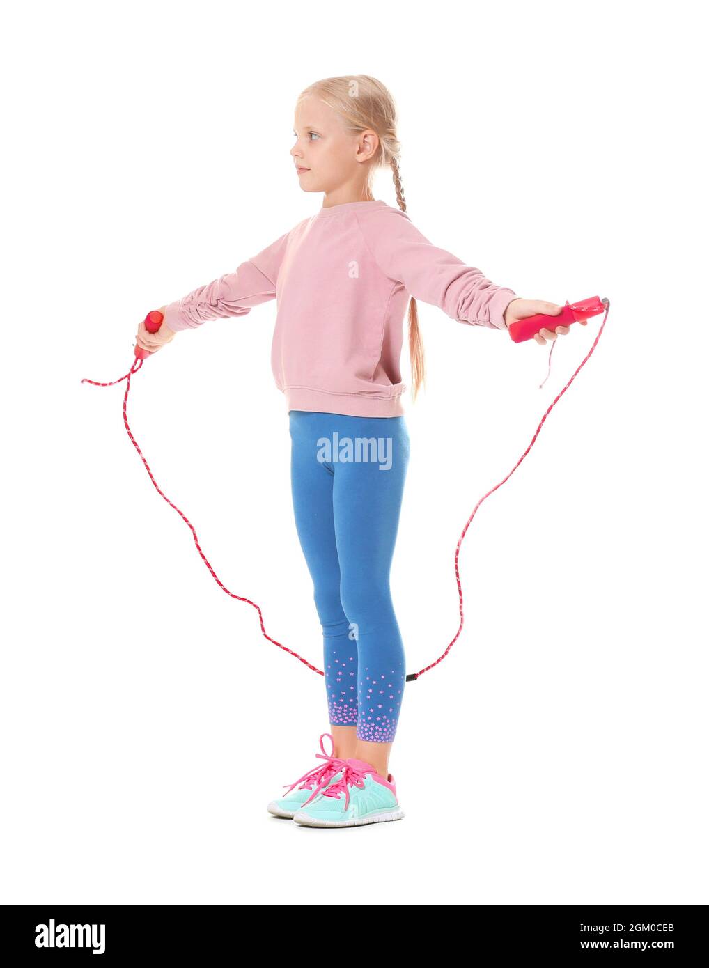 Adorable girl skipping rope, isolated on white Stock Photo - Alamy