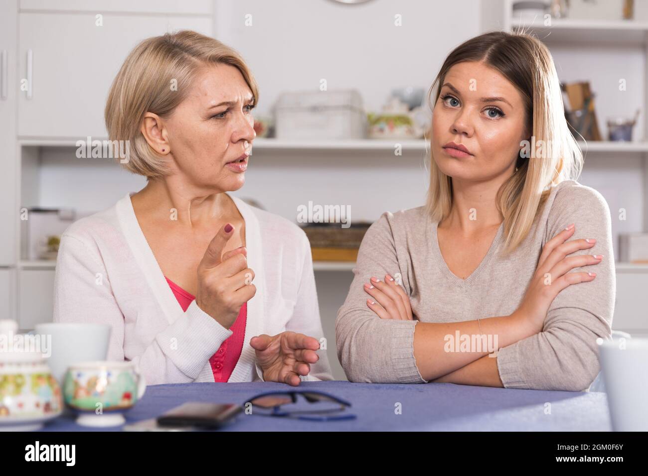 Mother scolds her adult daughter Stock Photo - Alamy